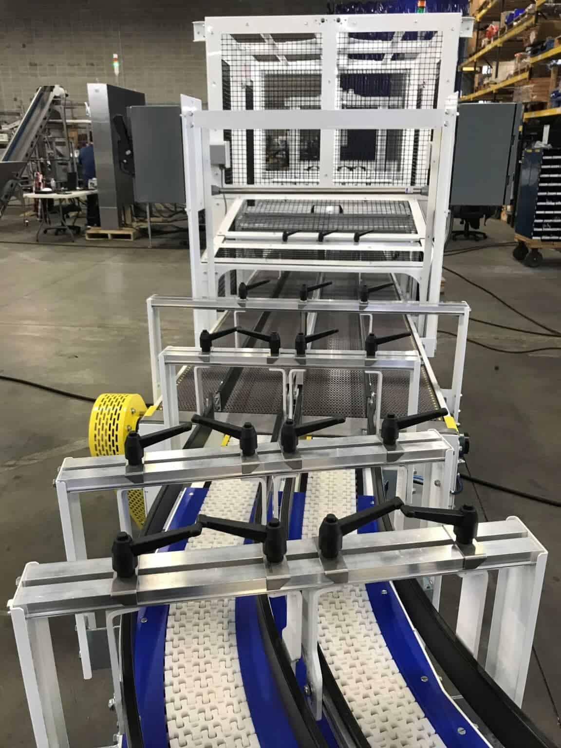 Conveyor control systems optimize variables in product flow